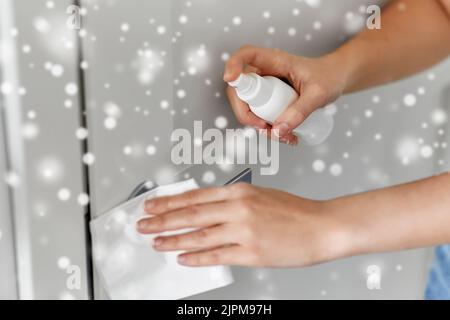 hand cleaning door handle with disinfectant spray Stock Photo - Alamy