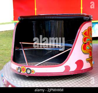 Riding the Waltzer at a fun fair Stock Photo - Alamy