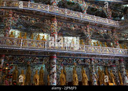 Numerous golden buddhist statues inside Linh Phuoc Pagoda in Da lat ...