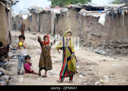 Islamabad, Pakistan. 18th Aug, 2022. Afghan refugee children play at a ...