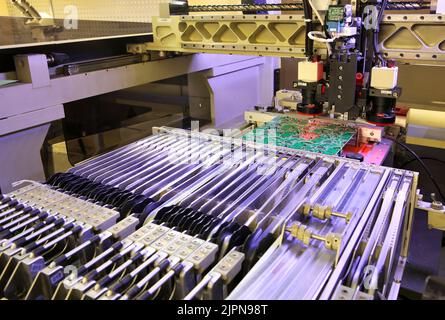 Installer of SMD parts on boards and soldering parts. Machine for ...