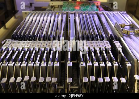 Installer of SMD parts on boards and soldering parts. Machine for ...