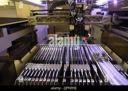 Installer of SMD parts on boards and soldering parts. Machine for ...