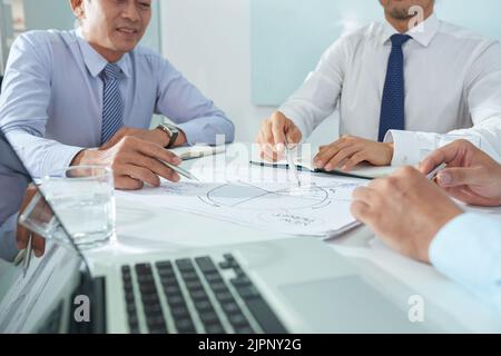 Cropped image of a team of financial management having a financial ...