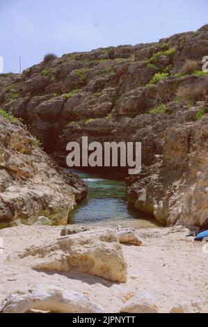 A rocky cliff overseeing the blue ocean on a sunny day Stock Photo - Alamy