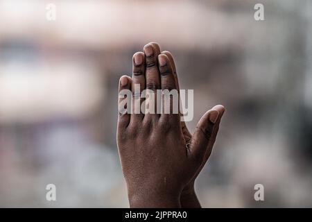 Hands together praying sign Stock Photo - Alamy