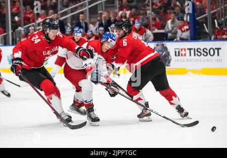 Canada's Ethan Del Mastro (24) and Lukas Cormier (6) defend against ...