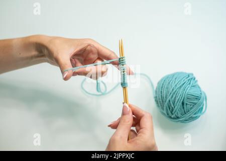 set of loops on the needles step by step. wool and cotton knitting ...