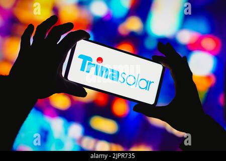 In this photo illustration, the Trina Solar logo is displayed on a ...