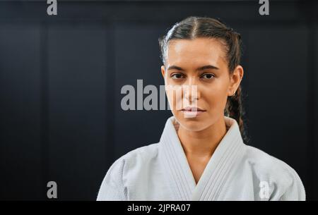 Karate trainer standing in gym Stock Photo - Alamy