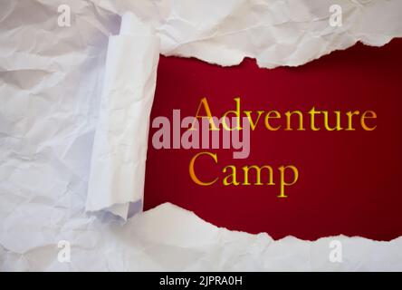 Adventure Camp text with Torn, Crumpled White Paper on colored ...