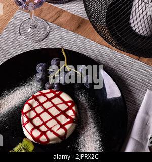 High angle shot of some fresh and delicious cherries and some leaves on ...