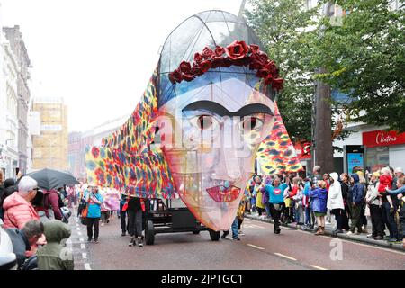 People line the streets as the Mela Carnival parades through Belfast ...