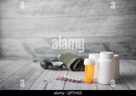 blood pressure machine and medical pill on table Stock Photo - Alamy
