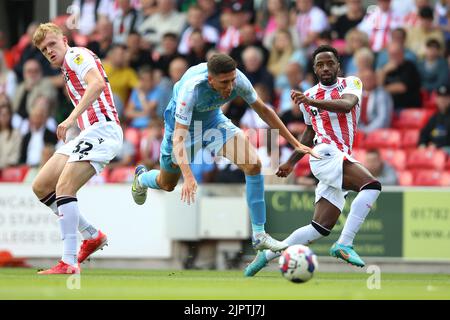 Stoke City's Connor Taylor (left) and Tariqe Fosu (right) battle for ...