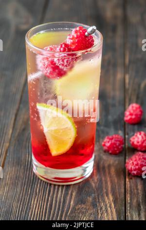 Glass of Raspberry lime rickey cocktail garnished with fresh berries ...