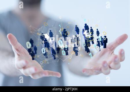 The 3d rendered people icons and binary codes hovering over male hands ...