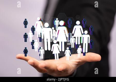 The 3d rendered people icons hovering over a man's hand Stock Photo - Alamy