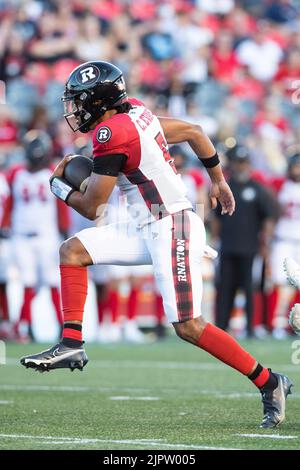 August 19, 2022: Ottawa Redblacks quarterback Caleb Evans (5) runs for ...