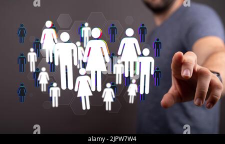 The hand pointing at hovering people icons. Human resources concept ...