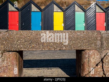 Colourful beach huts on Lowestoft promenade. Captured on a bright and ...