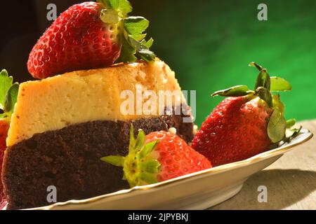 Passion fruit mousse with strawberries decoration Stock Photo - Alamy