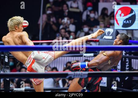 Kota Miura (R) of Japan Buakaw Banchamek of Thailand and seen in action ...