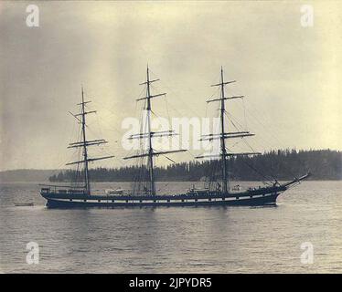 The three-masted sailing vessel FLOTTBEK is shown in waters off ...