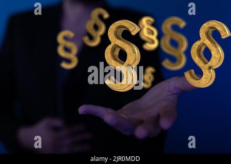 A number of digital paragraph icons floating on a hand - law and ...