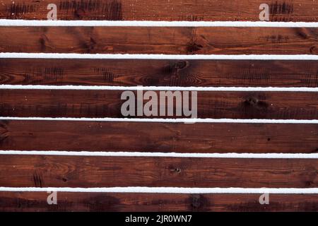 Wooden fence background with snow lying on the boards Stock Photo - Alamy