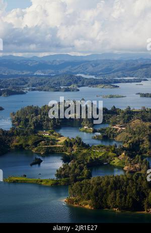 An aerial vertical shot of the Guatape town in Columbia with clouded ...