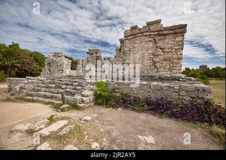 Side view of the remains of a small Mayan temple in the Tulum complex ...