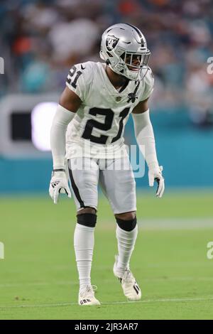 Las Vegas Raiders' Amik Robertson (21) and Divine Diablo (5) tackle ...