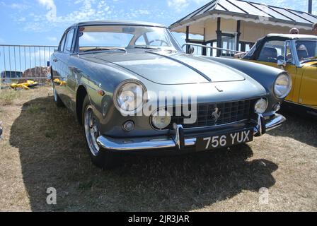 A 1961 Ferrari 250 GTE parked on display at the English Riviera classic ...