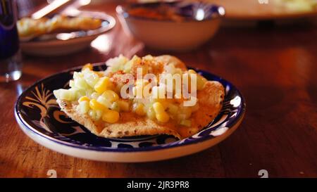 Nachos with meat in a ceramic plate Stock Photo - Alamy