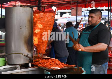 Food vendor preparing Al pastor meat at Lucas de Galvez market, Merida ...
