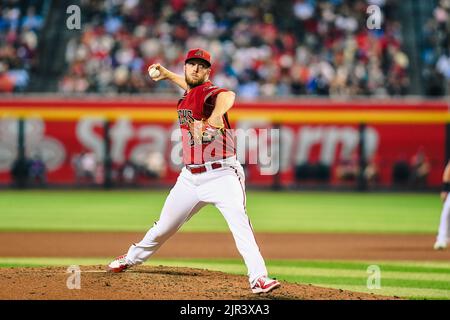 Arizona Diamondbacks pitcher Merrill Kelly throws against the Kansas ...