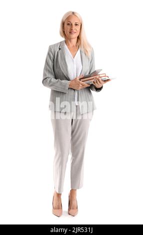 Mature Math teacher with calculator and books on white background Stock ...