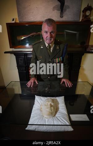 Corporal Noel McDonnell, pictured with the death mask of Michael ...
