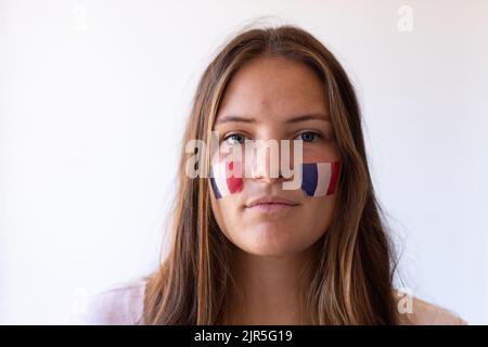 Image of serious caucasian woman with flags of france on face Stock ...