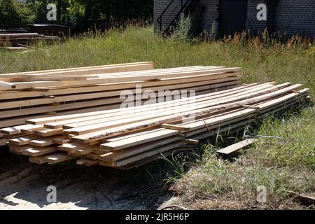 Folded finished boards at the sawmill close up Stock Photo - Alamy