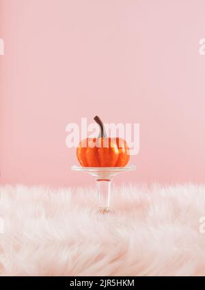 Halloween minimal concept with pink pumpkin, skull and cocktails ...
