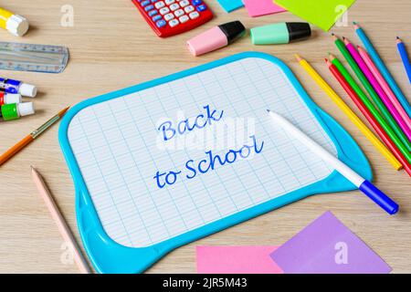 White slate with inscription "Back to school - September 1, 2022" in ...