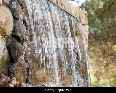 landscape of beautiful Artificial waterfall in garden at the public ...
