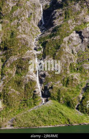 Beautiful and imposing Norwegian fjord in spring with its waterfalls ...
