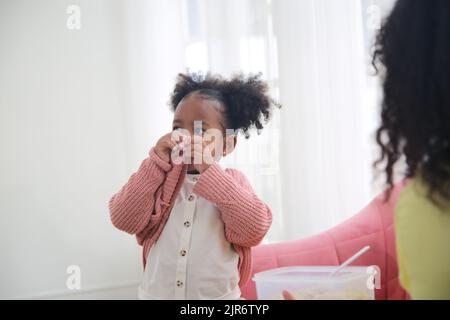 Shot of happy interracial family of mother father and their daughter ...
