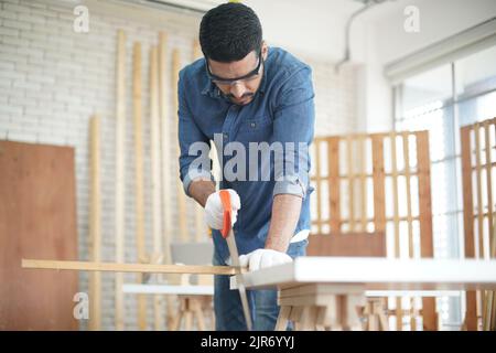 Carpenter grinding joinery product with carvings, finishing woodwork at ...