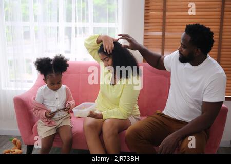 Shot of happy interracial family of mother father and their daughter ...