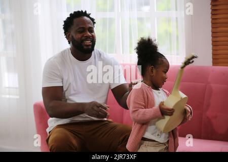 Shot of happy interracial family of mother father and their daughter ...