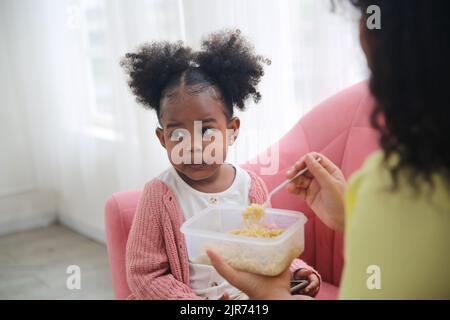 Shot of happy interracial family of mother father and their daughter ...
